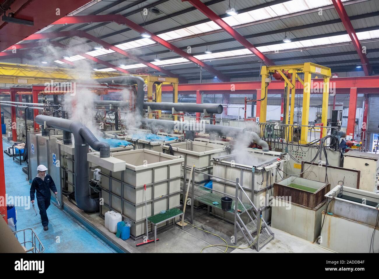 Electroless nickel plating factory. Chemical tanks and rinse tanks at a ...