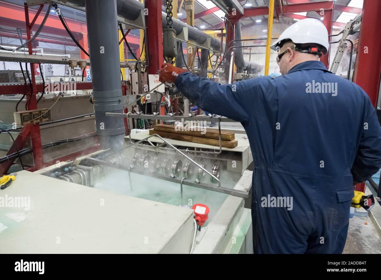 Electroless nickel plating factory. Chemical tanks and rinse tanks at a ...