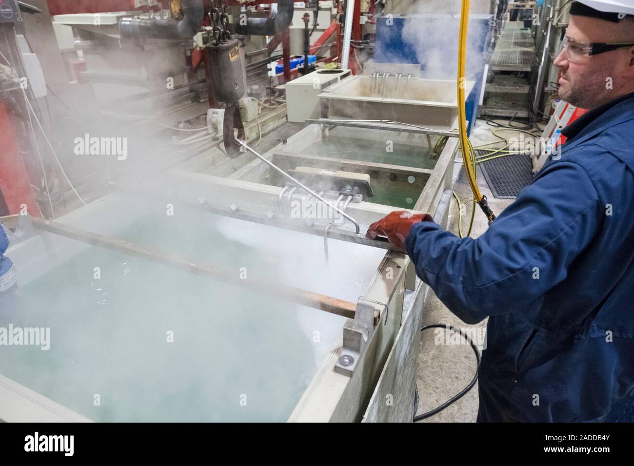 Electroless nickel plating factory. Chemical tanks and rinse tanks at a ...