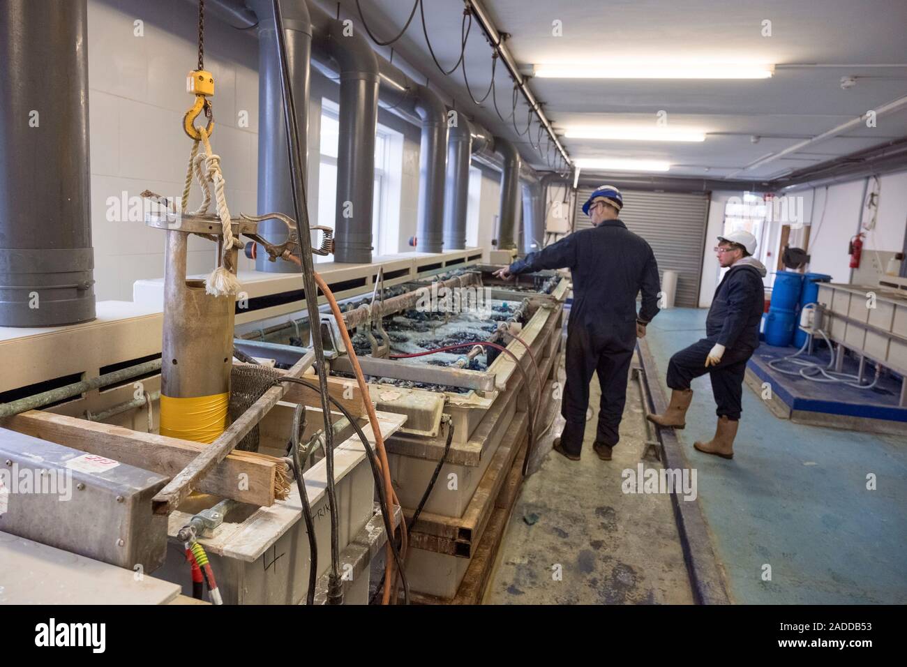 Copper plating factory. Rinse tanks at a factory specialising in copper ...