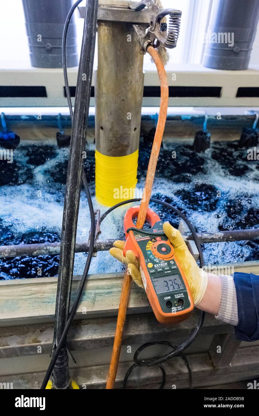 Copper plating factory. Electricity flow being checked while a products ...