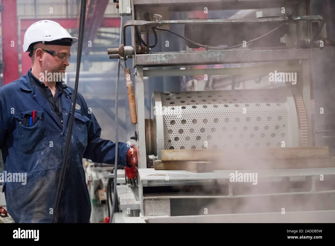 Electroless nickel plating factory. Worker at a factory specialising in ...