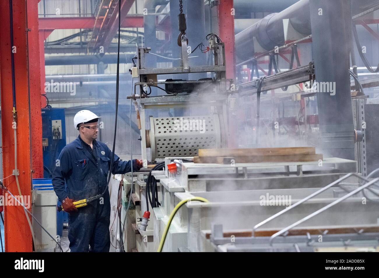 Electroless nickel plating factory. Worker at a factory specialising in ...