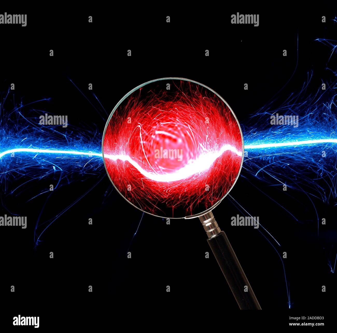 Electricity research. Conceptual image of a magnifying glass and ...