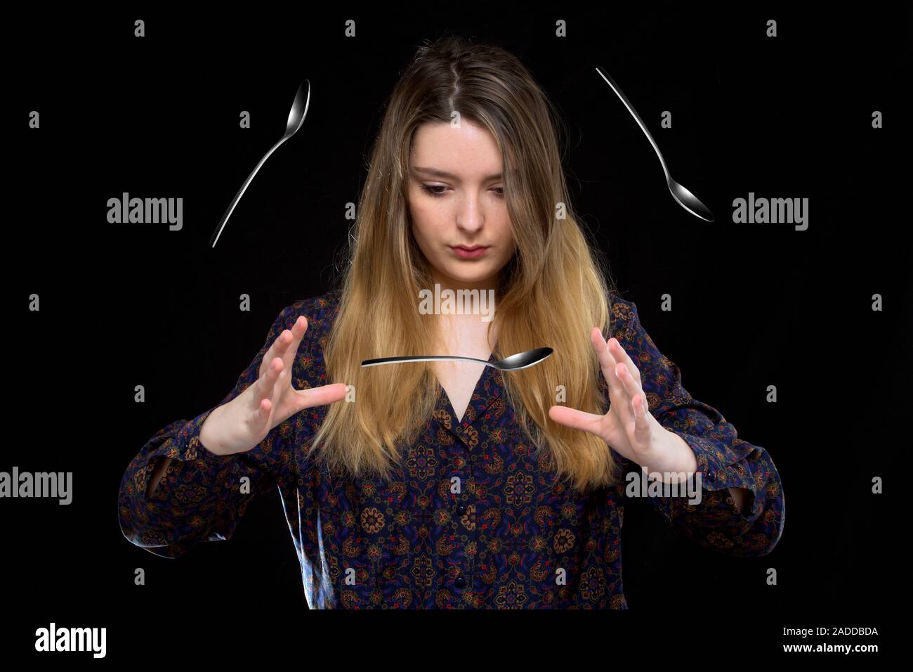 MODEL RELEASED. Telekinesis. Conceptual image of an 18-year-old girl ...
