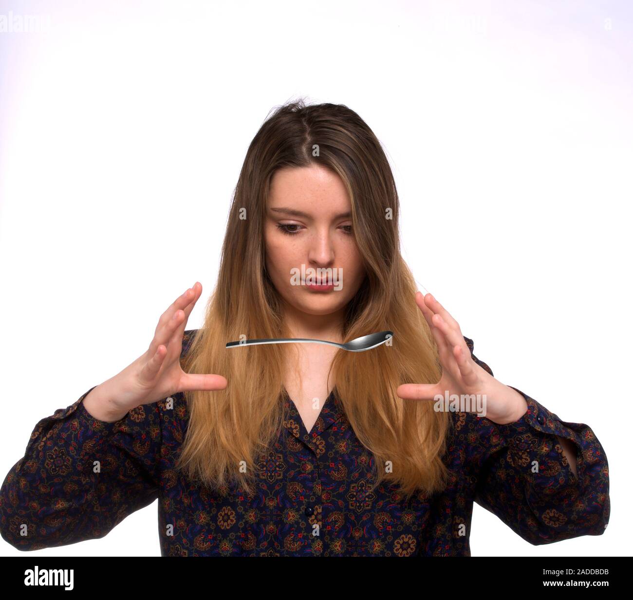 MODEL RELEASED. Telekinesis. Conceptual image of an 18-year-old girl ...