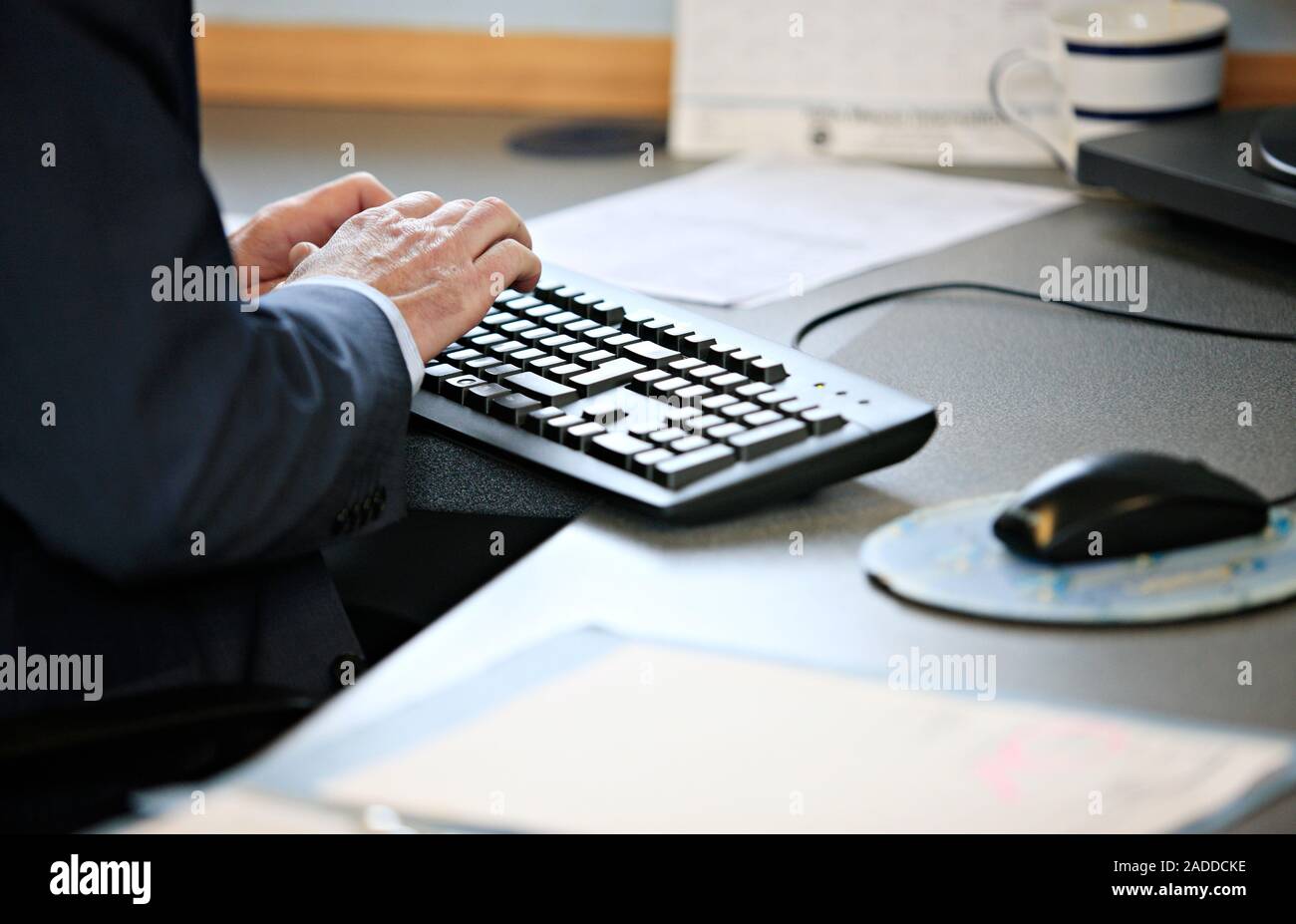 Office worker using keyboard Stock Photo - Alamy