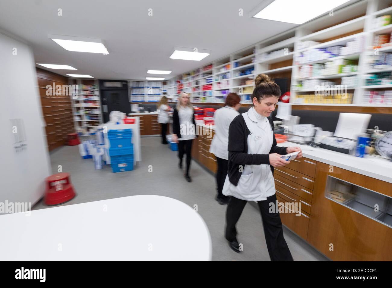 Pharmacy. Staff preparing prescriptions at a pharmacy Stock Photo - Alamy
