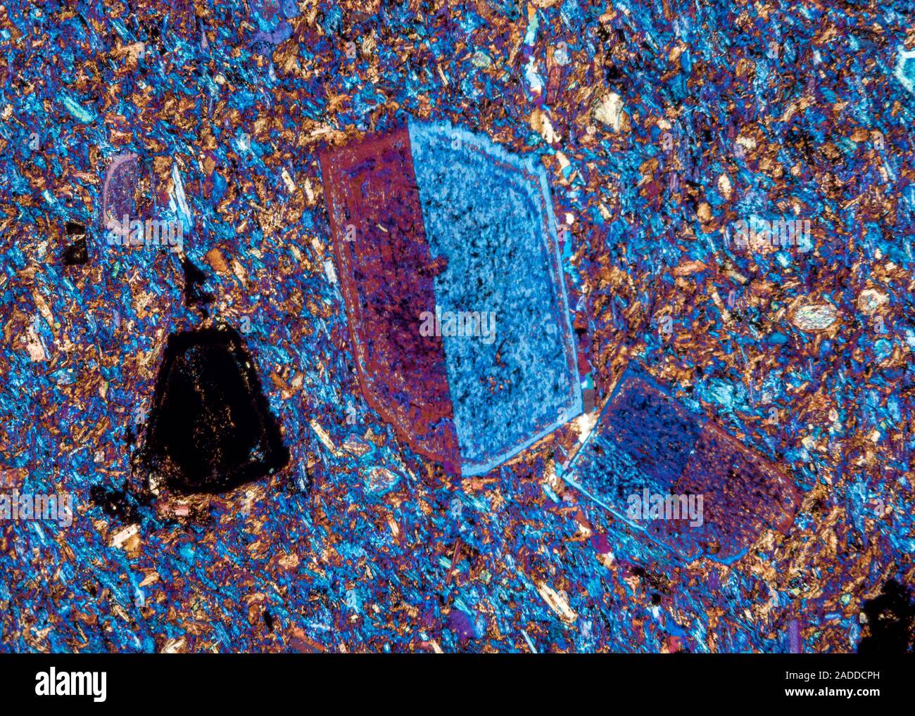Andelatite mineral rock crystals, polarised light micrograph. This rock ...