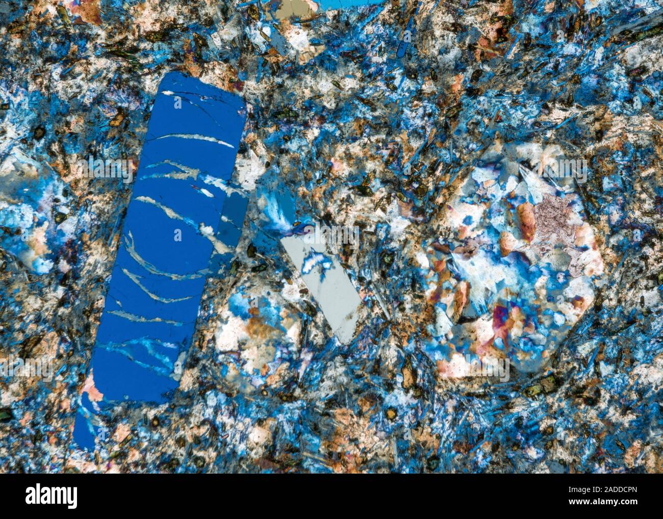 Phonolite mineral rock crystals, polarised light micrograph. This rock ...