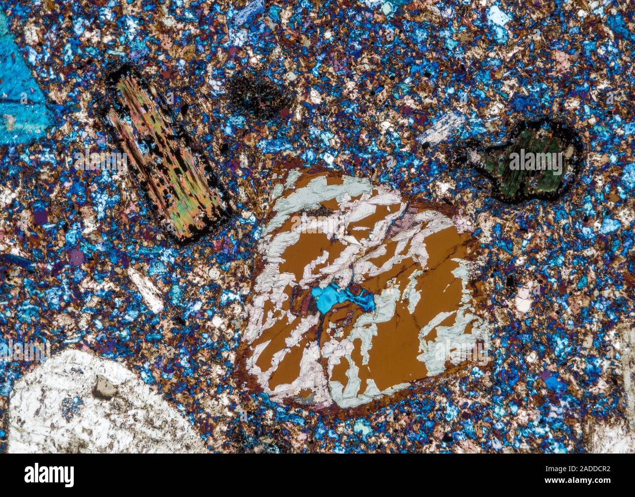 Rhyolite mineral rock crystals, polarised light micrograph. This rock ...