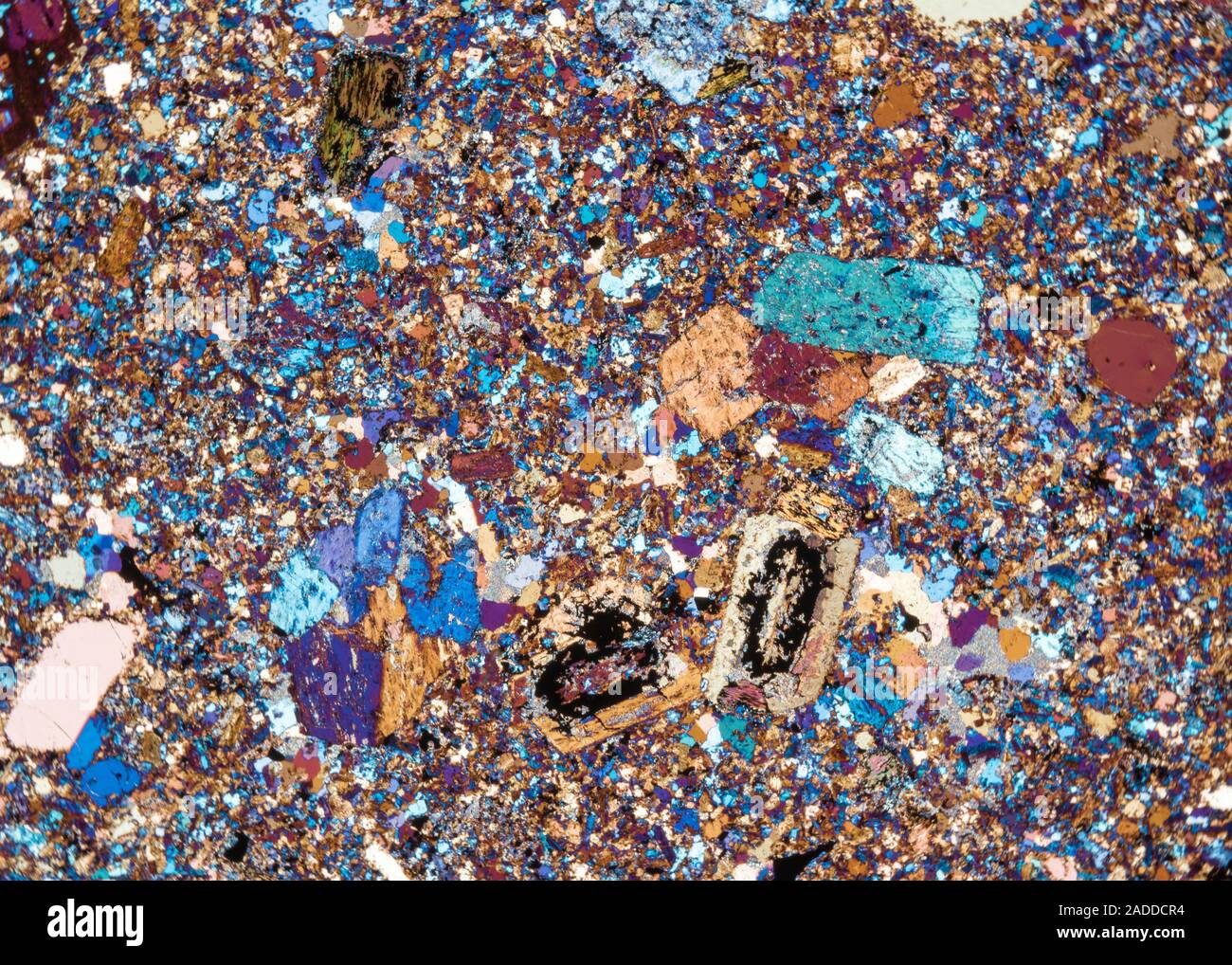 Rhyolite mineral rock crystals, polarised light micrograph. This rock ...