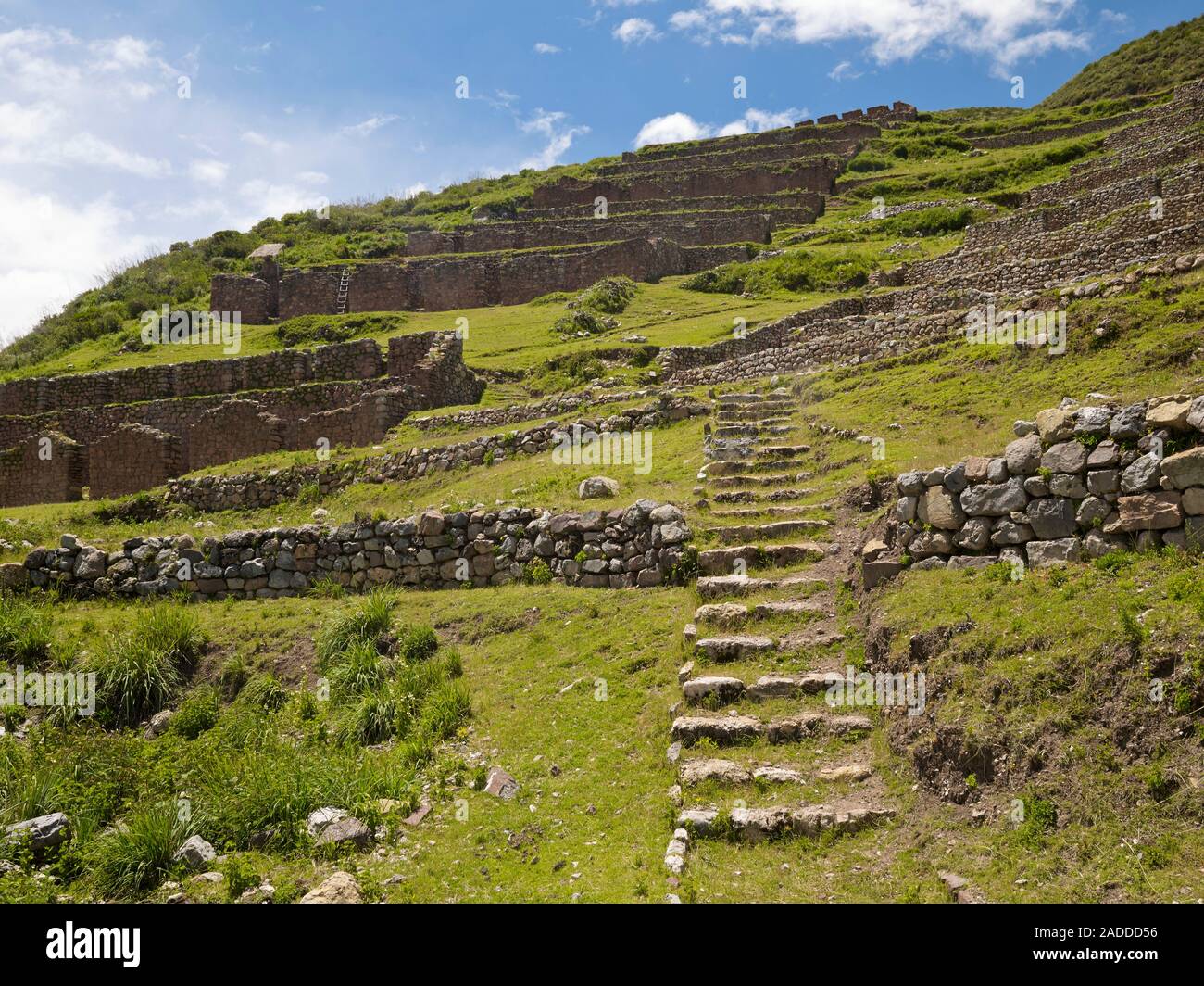 Inca ruins. Grass-covered ruins at the Incan archaeological site at ...