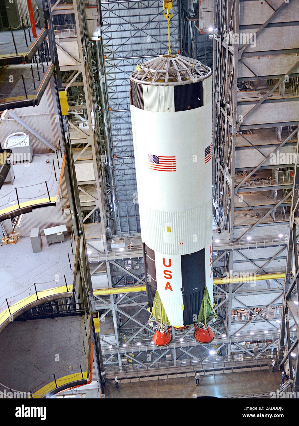 Saturn V first stage erection, 1967. Erection of the assembled first ...