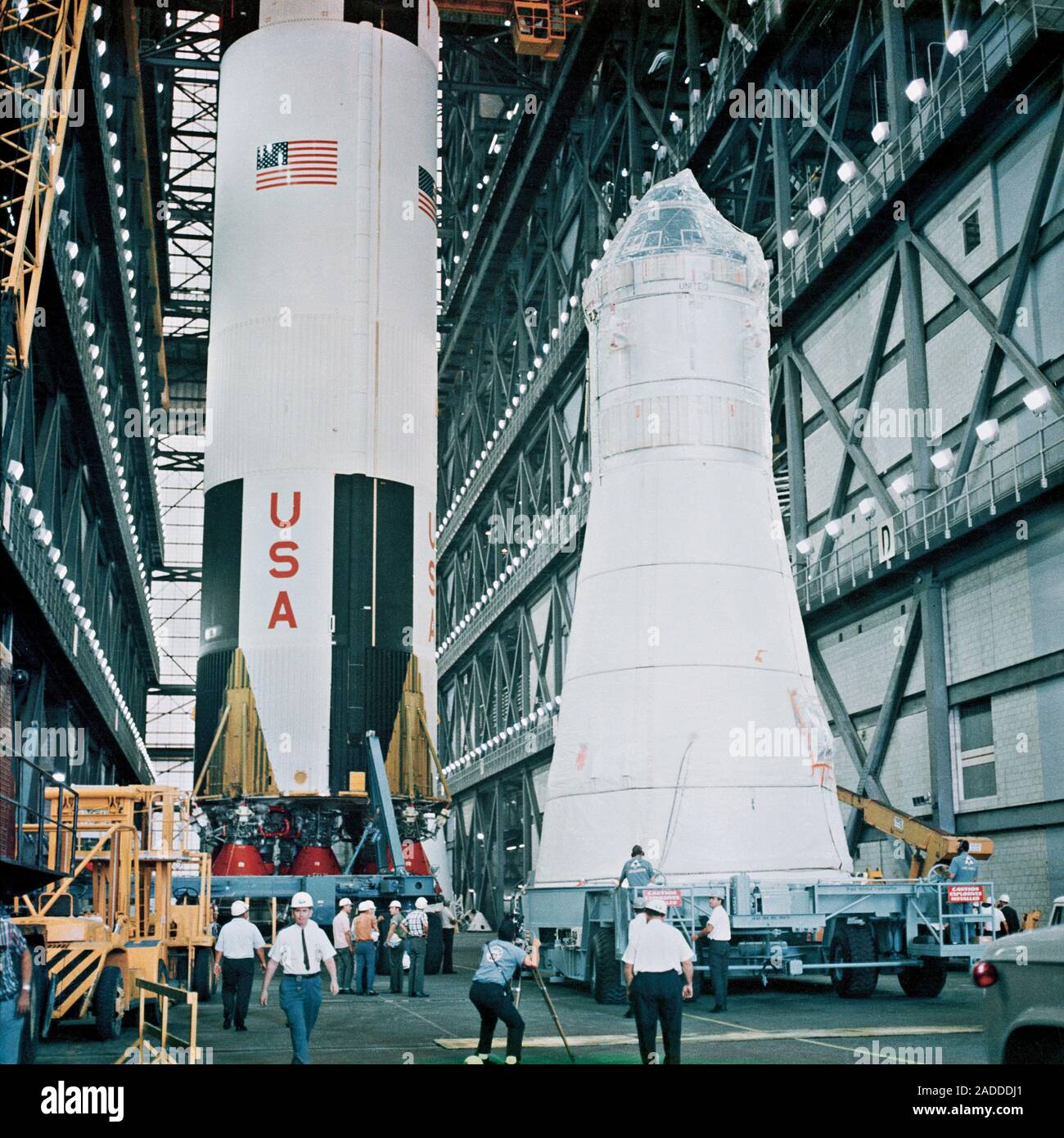Saturn V first stage and Apollo spacecraft. At left is a Saturn V first ...