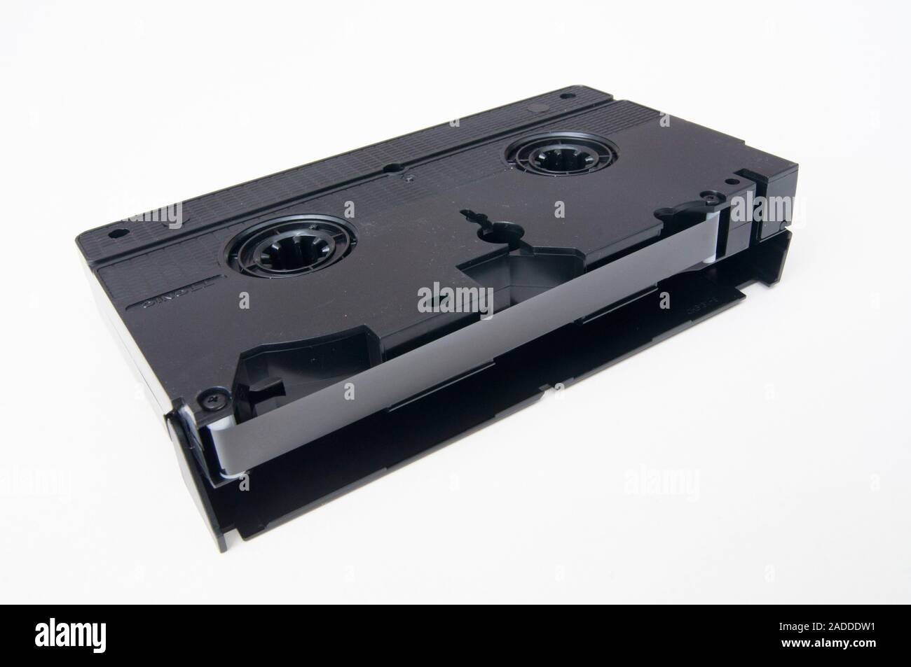 Video tape cassette displayed with its tape protection door opened to ...