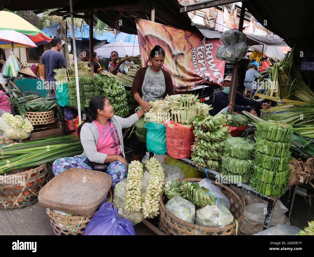 Market. Woman selling vegetables on a market stall. Photographed in ...