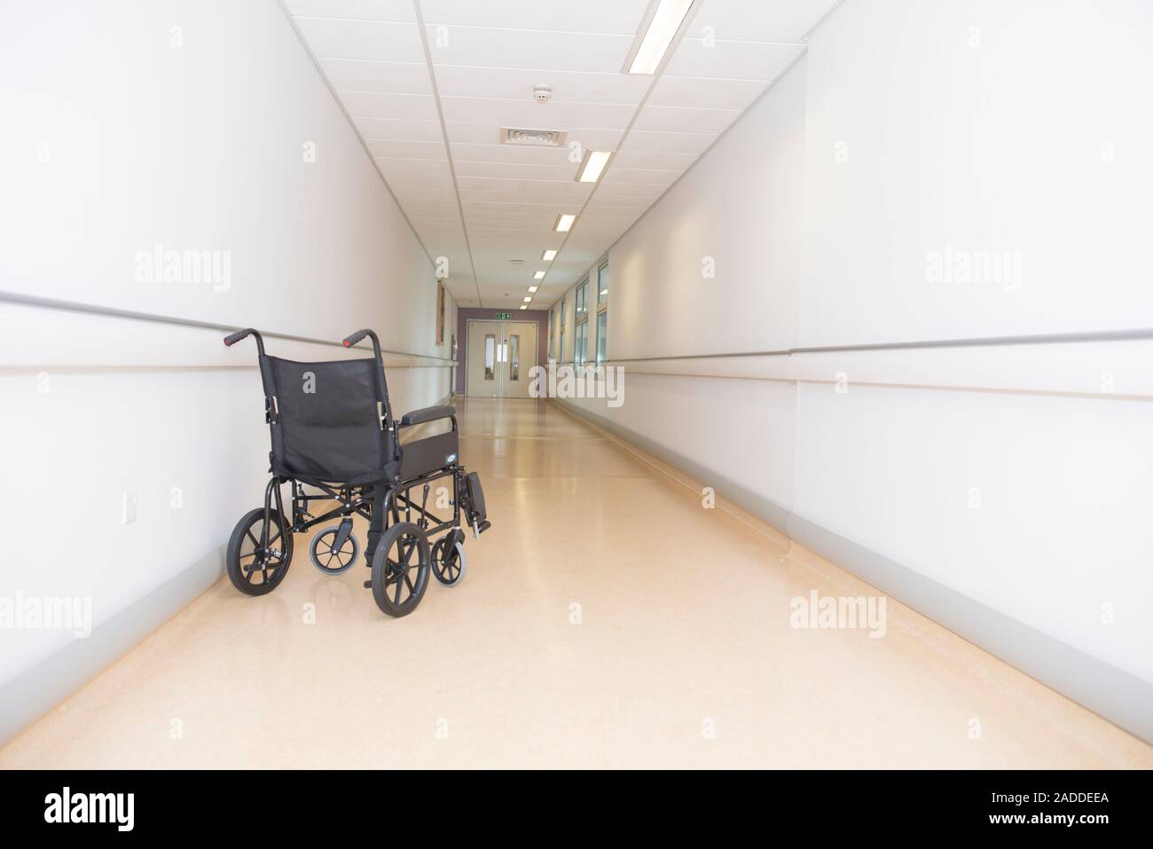 Wheelchair in a hospital corridor. Photographed in the UK Stock Photo ...
