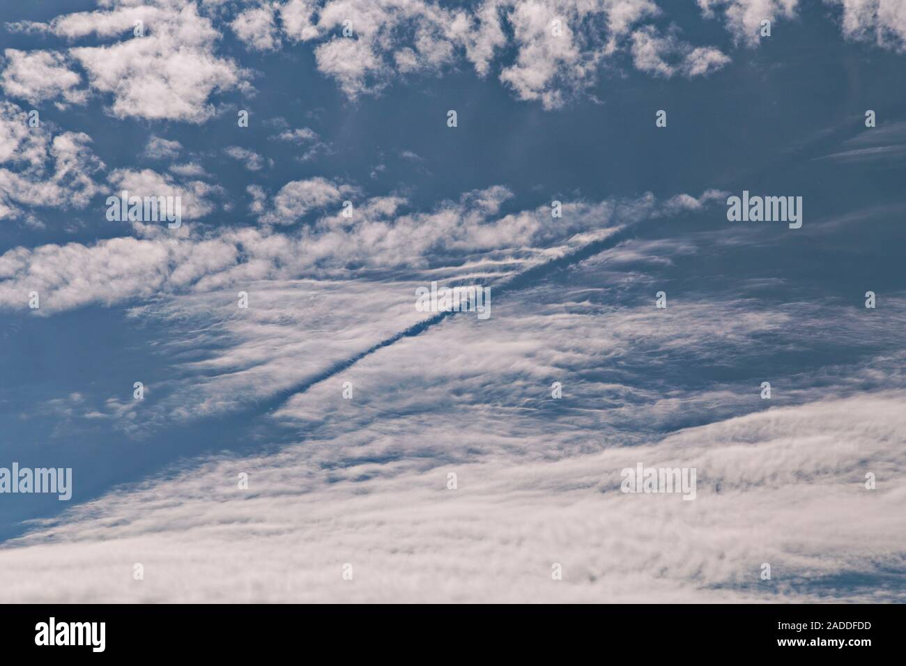 Aircraft distrail in altocumulus clouds. Aircraft distrails ...