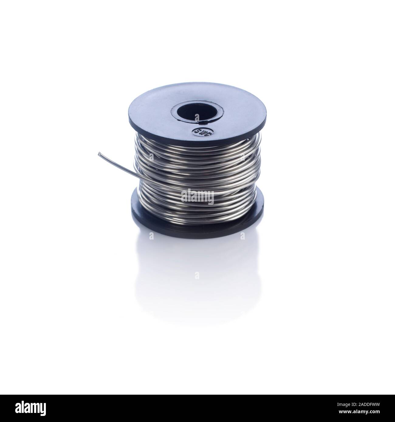 Coil of solder. Solder is an alloy that is melted to join metallic ...