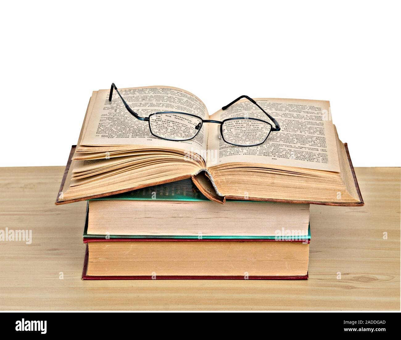 Eyeglasses on open book Stock Photo - Alamy