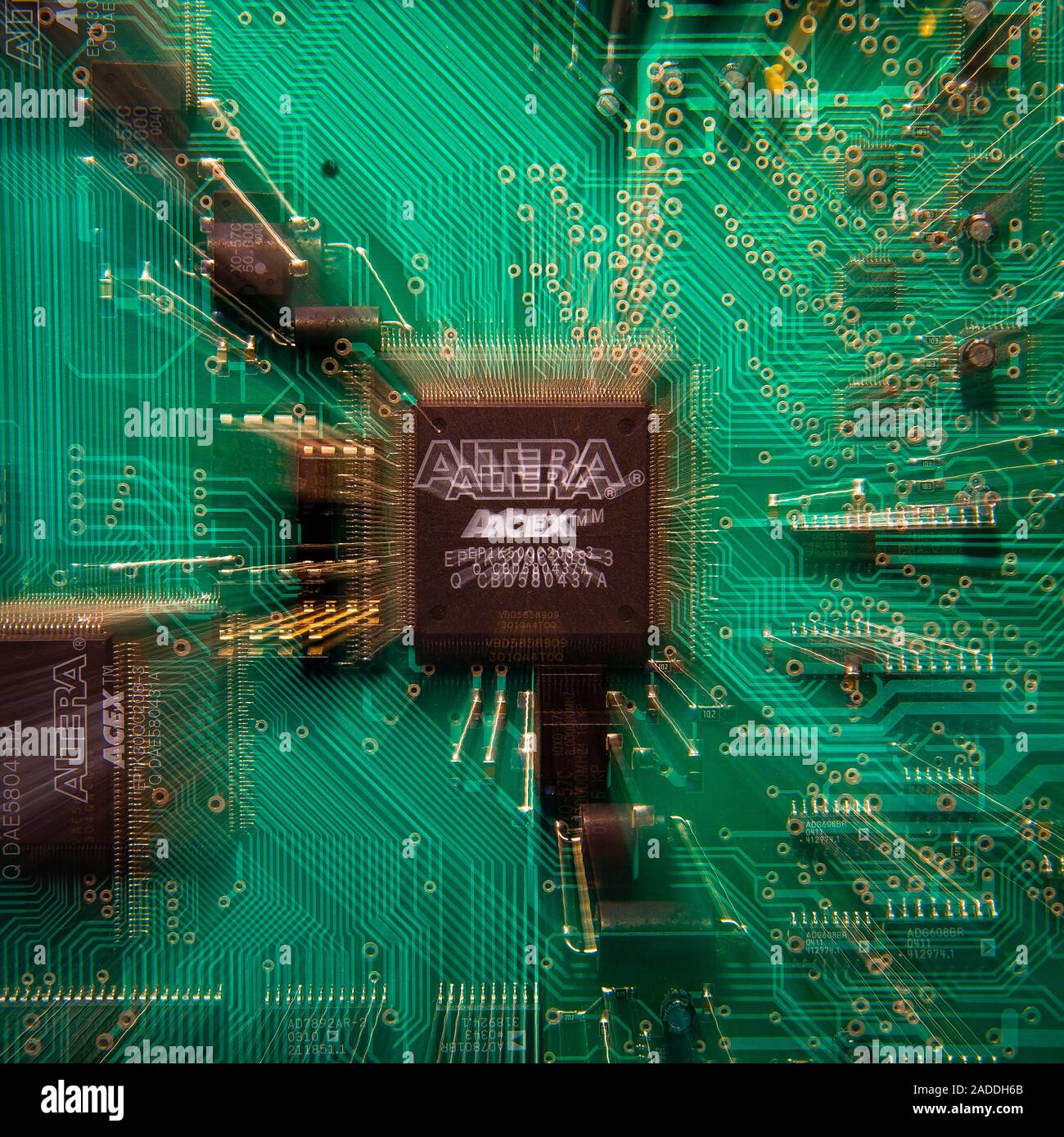 Microchip plugged into a circuit board, abstract image. Microchips ...