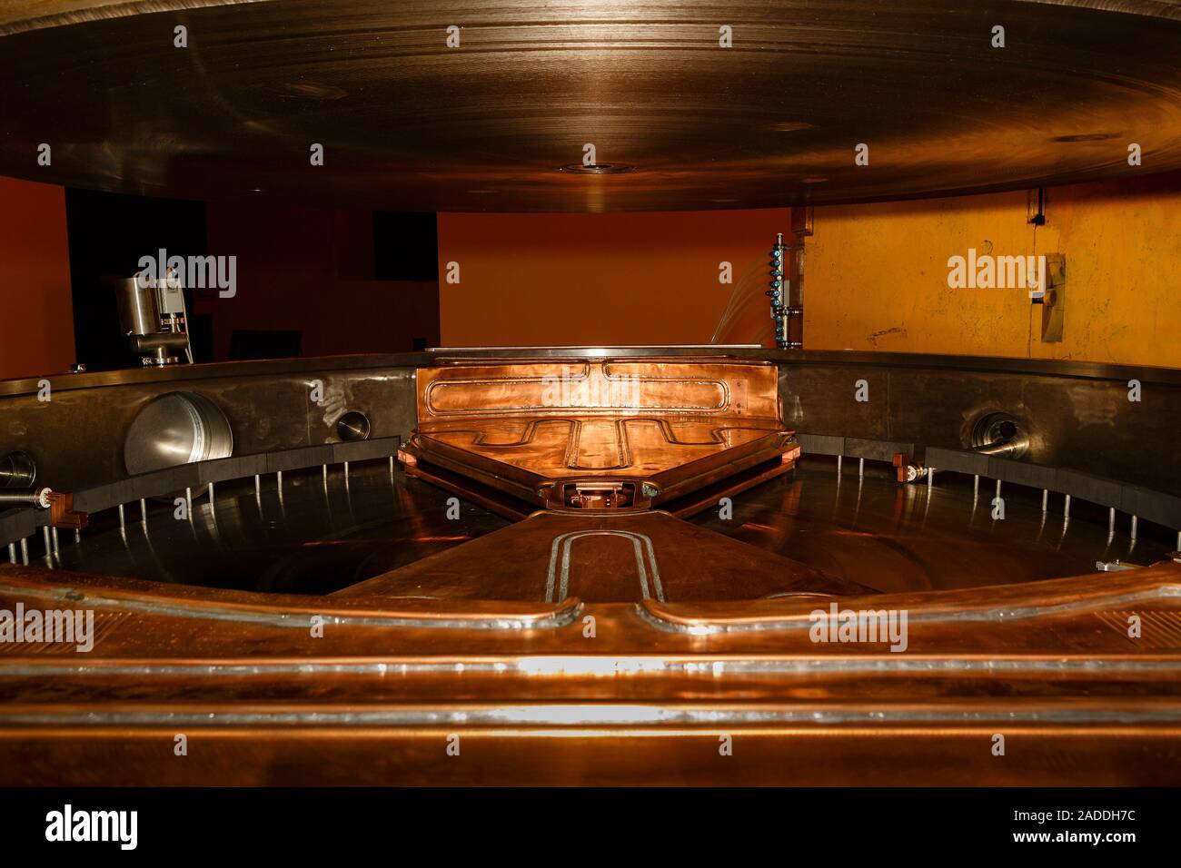 Cyclotron particle accelerator interior. The main cyclotron magnet is ...