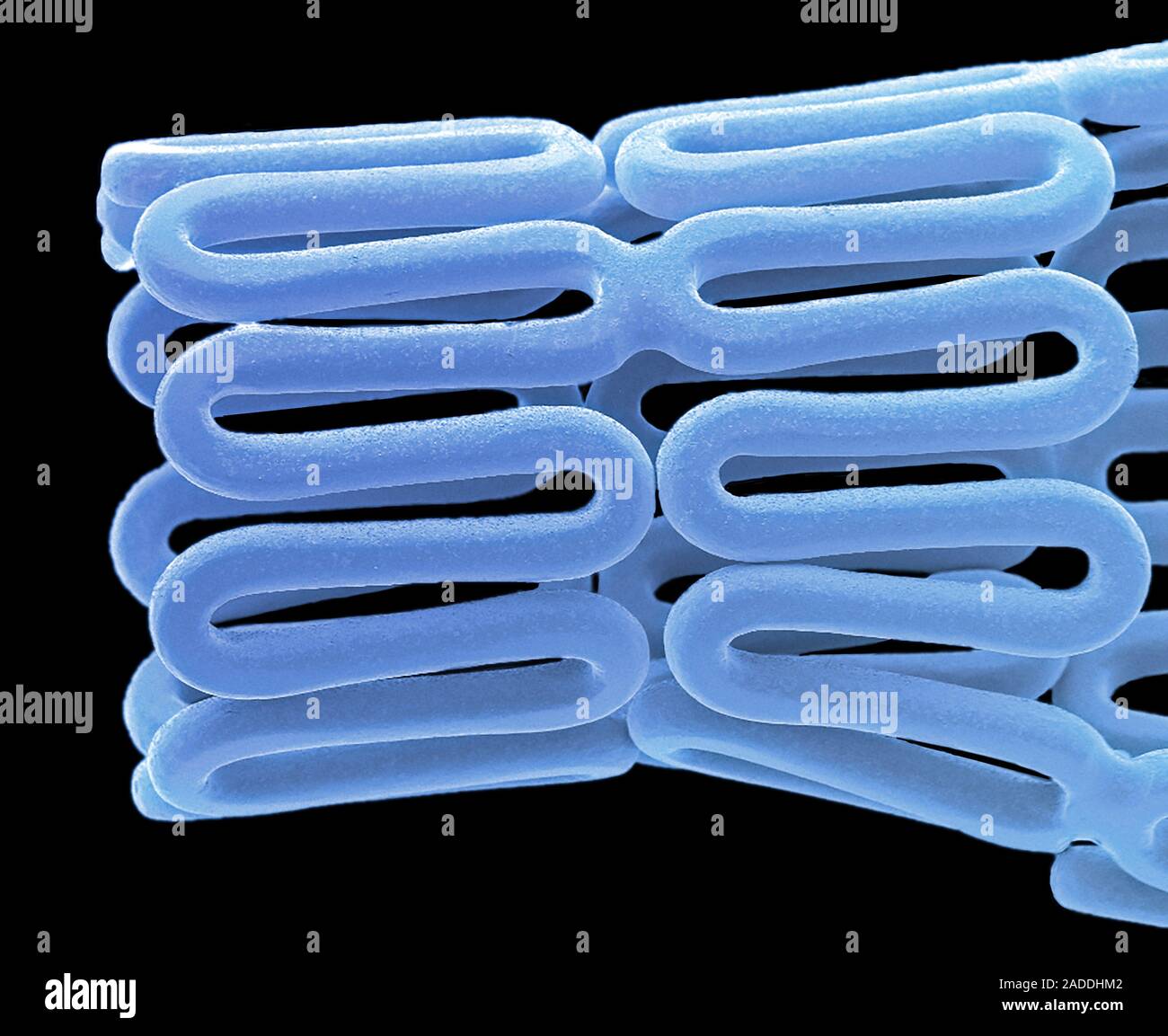 Coronary stent. Coloured scanning electron micrograph (SEM) of a stent ...