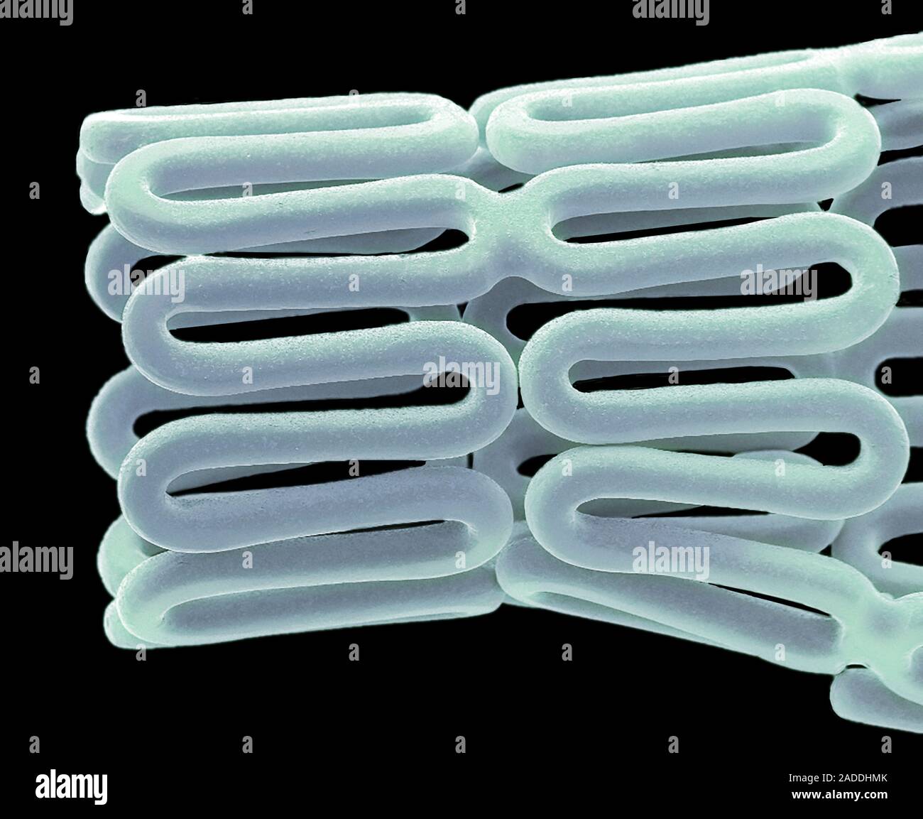 Coronary stent. Coloured scanning electron micrograph (SEM) of a stent ...