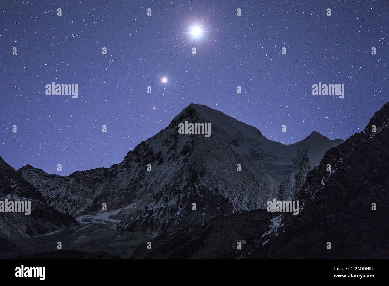 Planetary conjunction over a mountain in China. Planets Venus (top ...