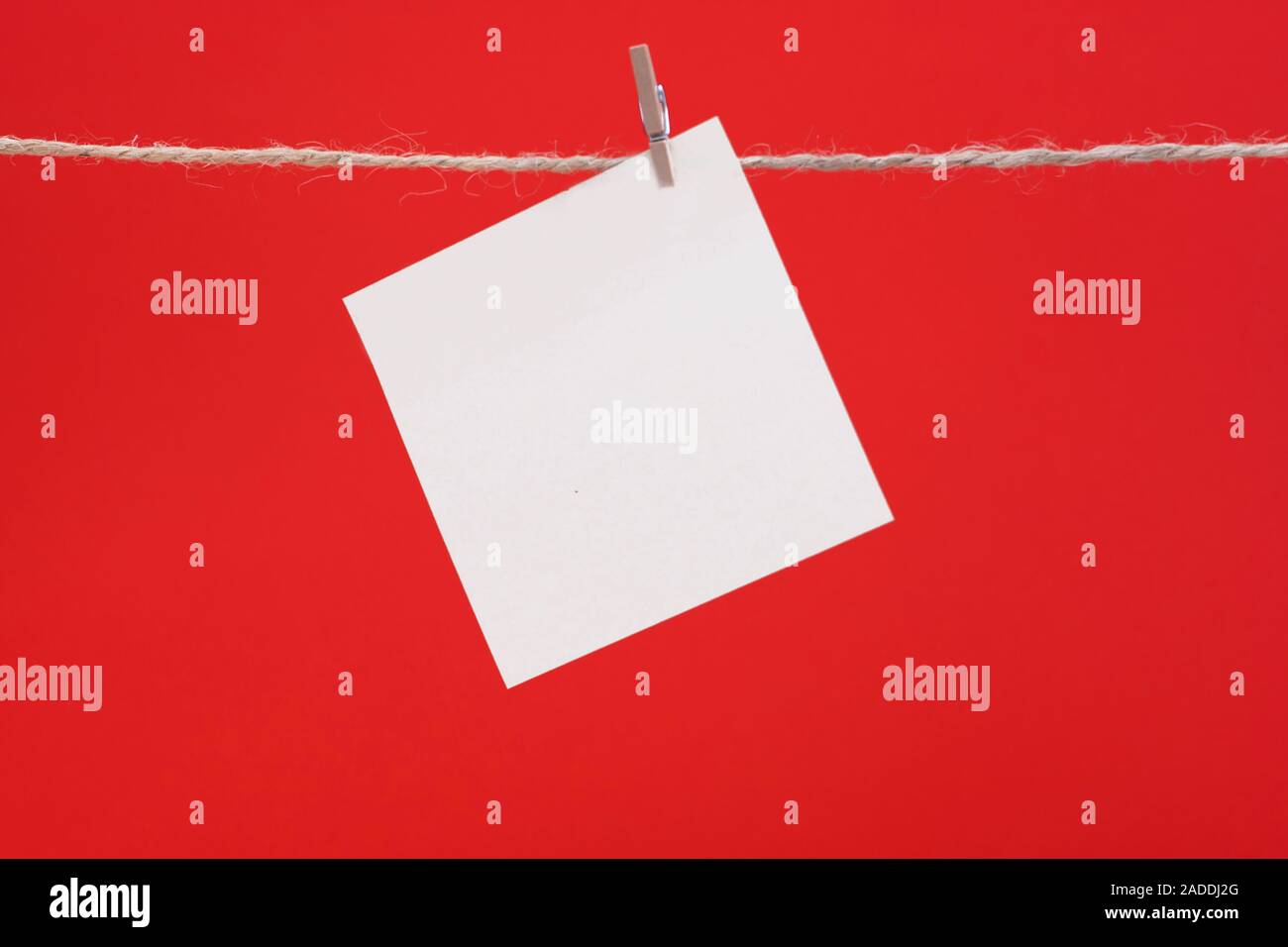 sheet of paper for notes hanging clothespins, copy space Stock Photo ...