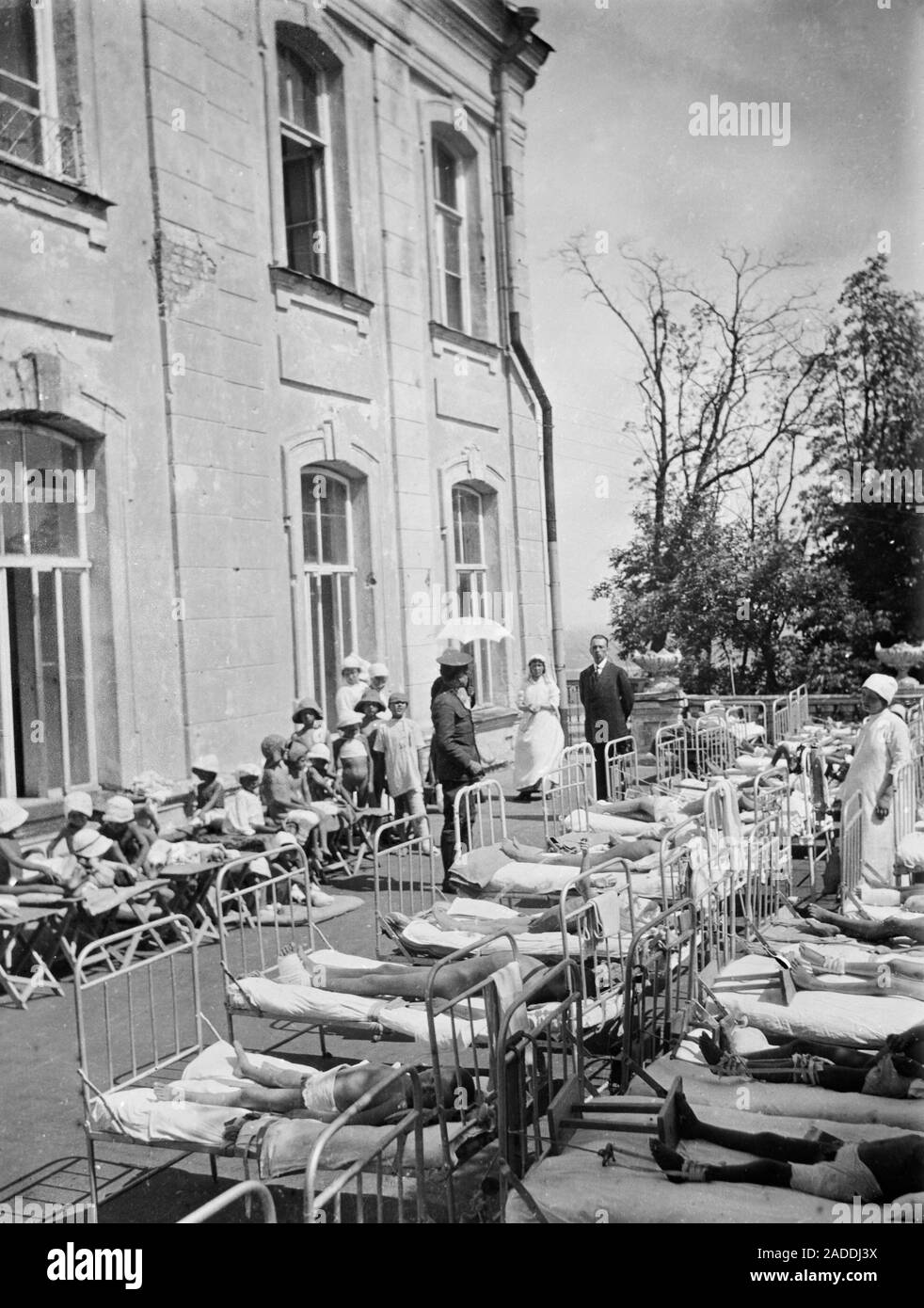 Children with tuberculosis lie in the sun to aid recovery at a Red ...