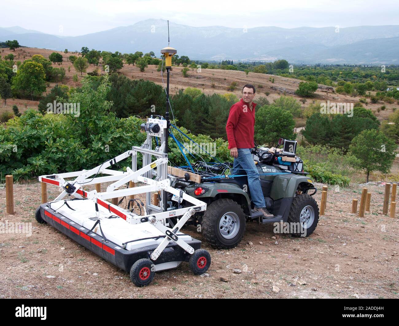 Ground radar, Neanderthal site. Researcher using a ground radar machine ...