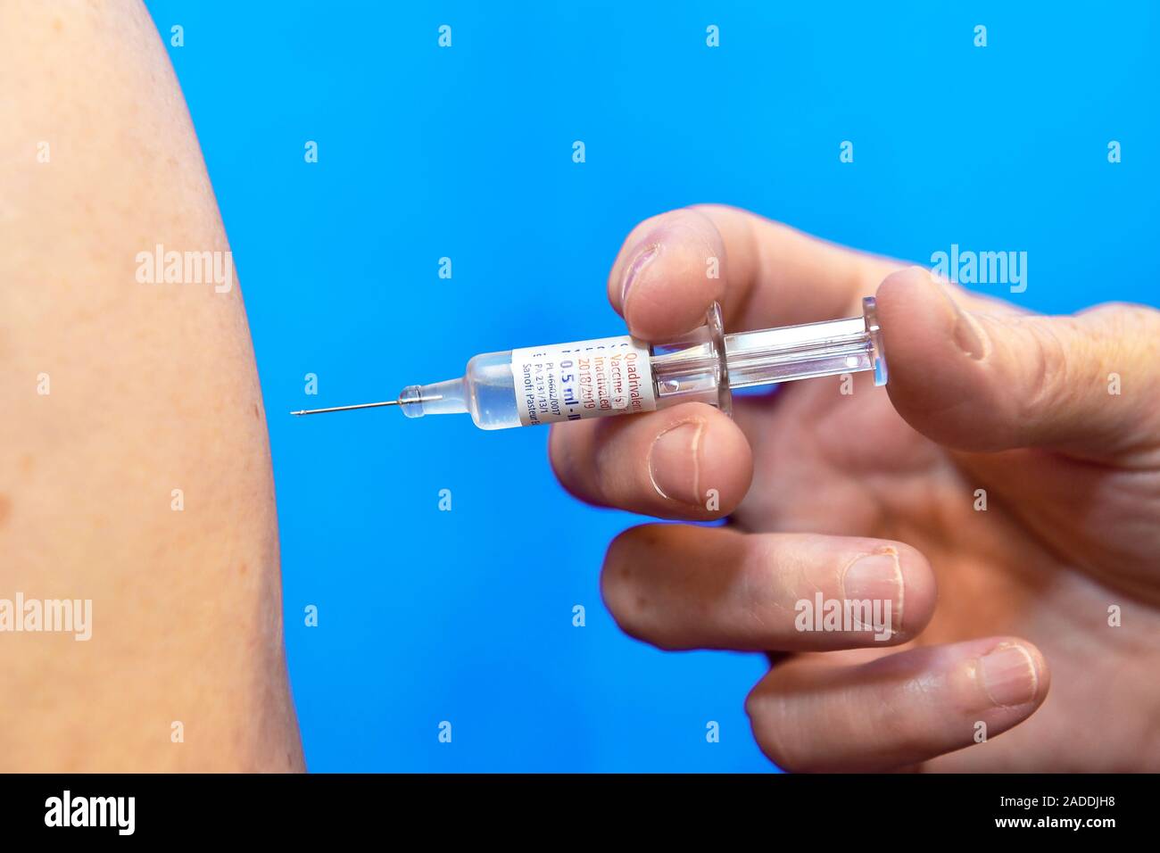Influenza vaccine injection. Injection into a patient's arm of the 2018 ...