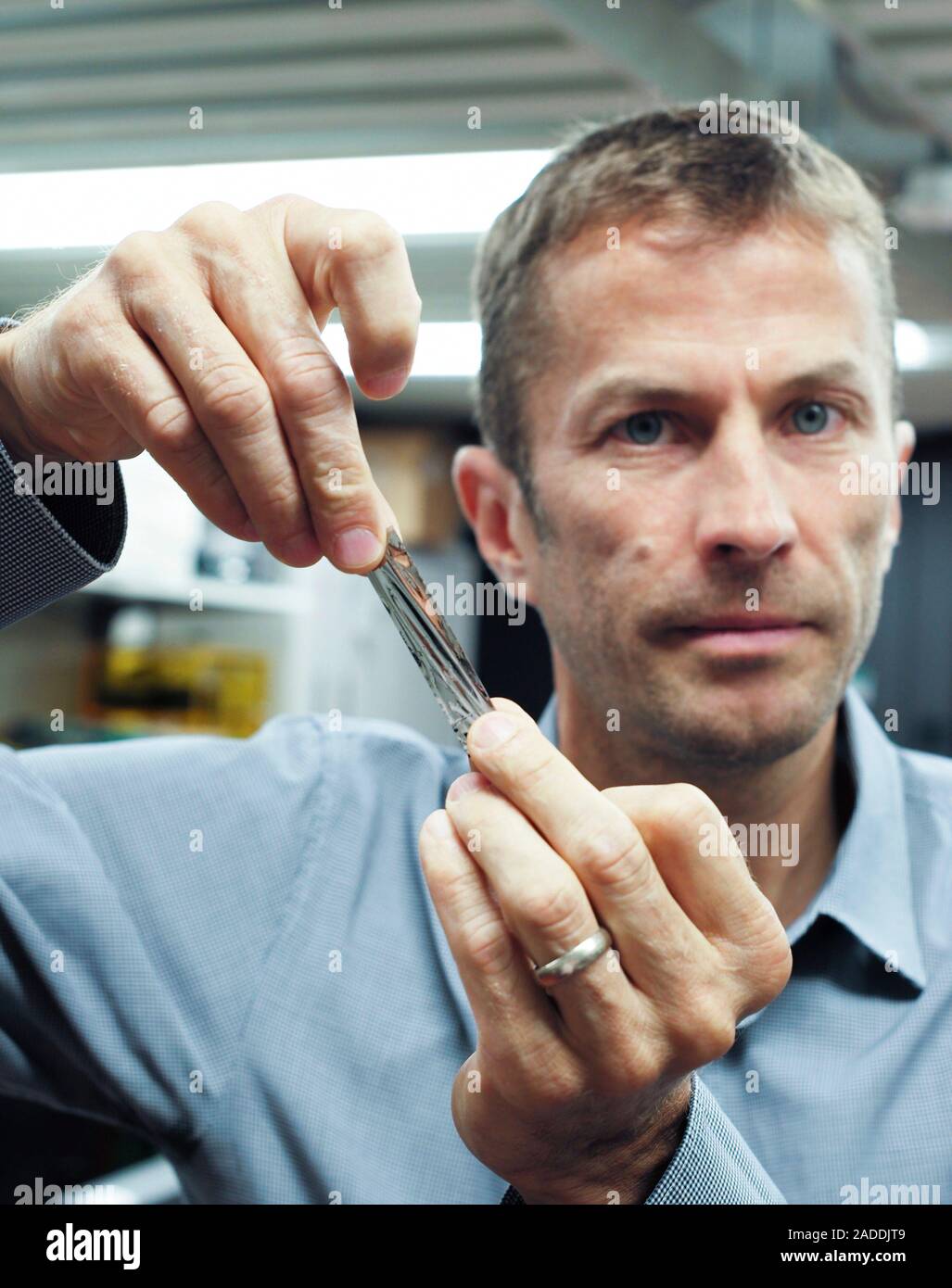 Record tape storage. IBM researcher Dr Mark Lantz displaying a ...