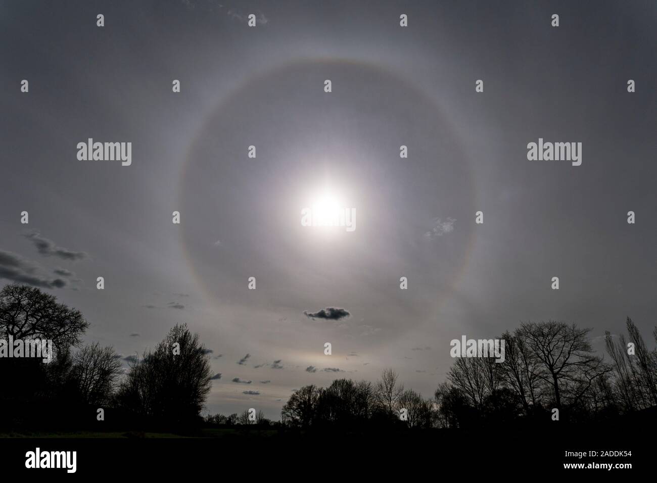 22-degree solar halo in cirrostratus clouds. This atmospheric optical ...