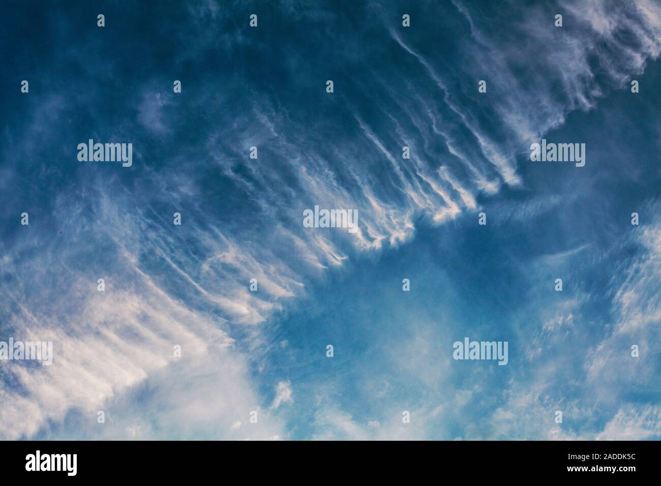 Wind-blown aircraft contrail. Aircraft contrails (condensation trails ...