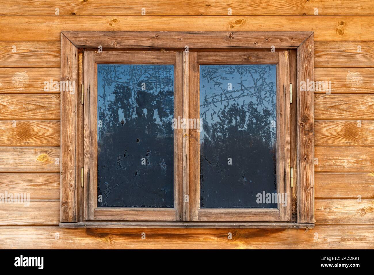 Frozen window of country log house in a village on winter Stock Photo ...
