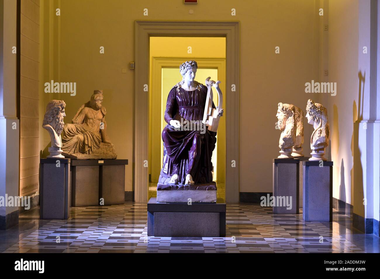 Roman statue of Apollo in a museum. The central statue depicts the god ...
