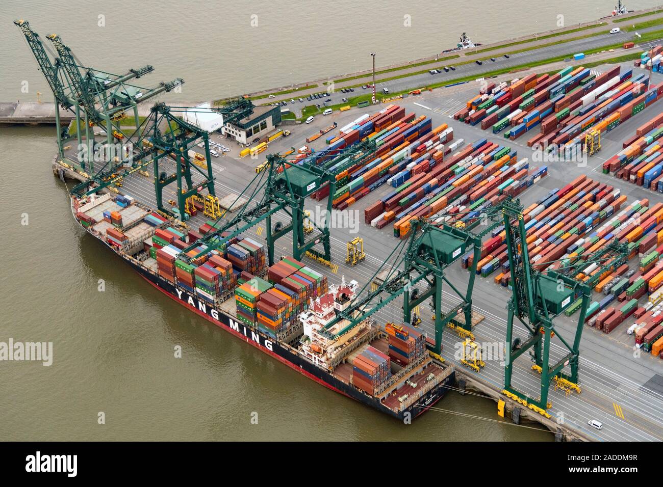 Barge loading shipping containers, aerial photograph. The containers ...