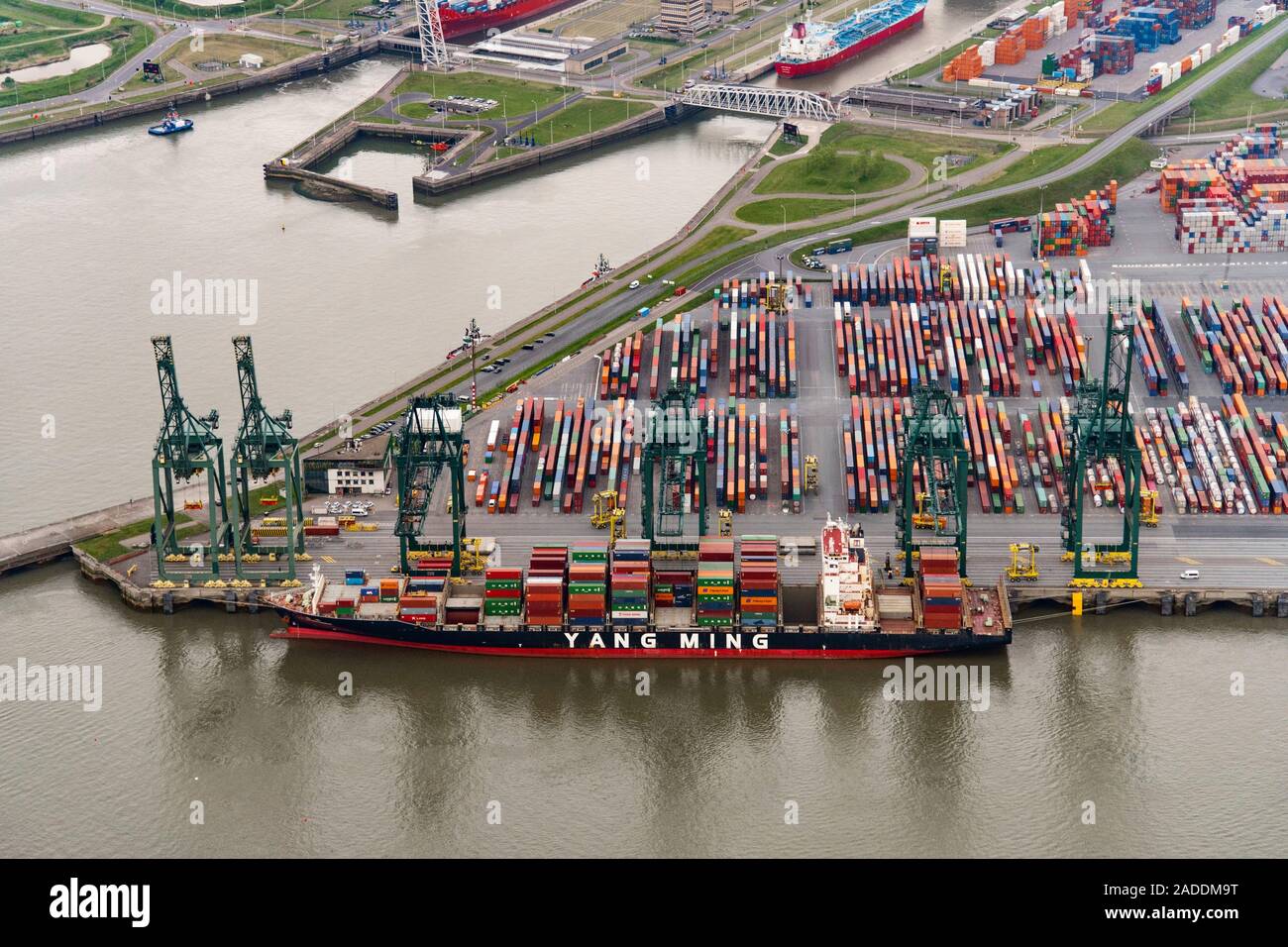 Barge loading shipping containers, aerial photograph. The containers ...