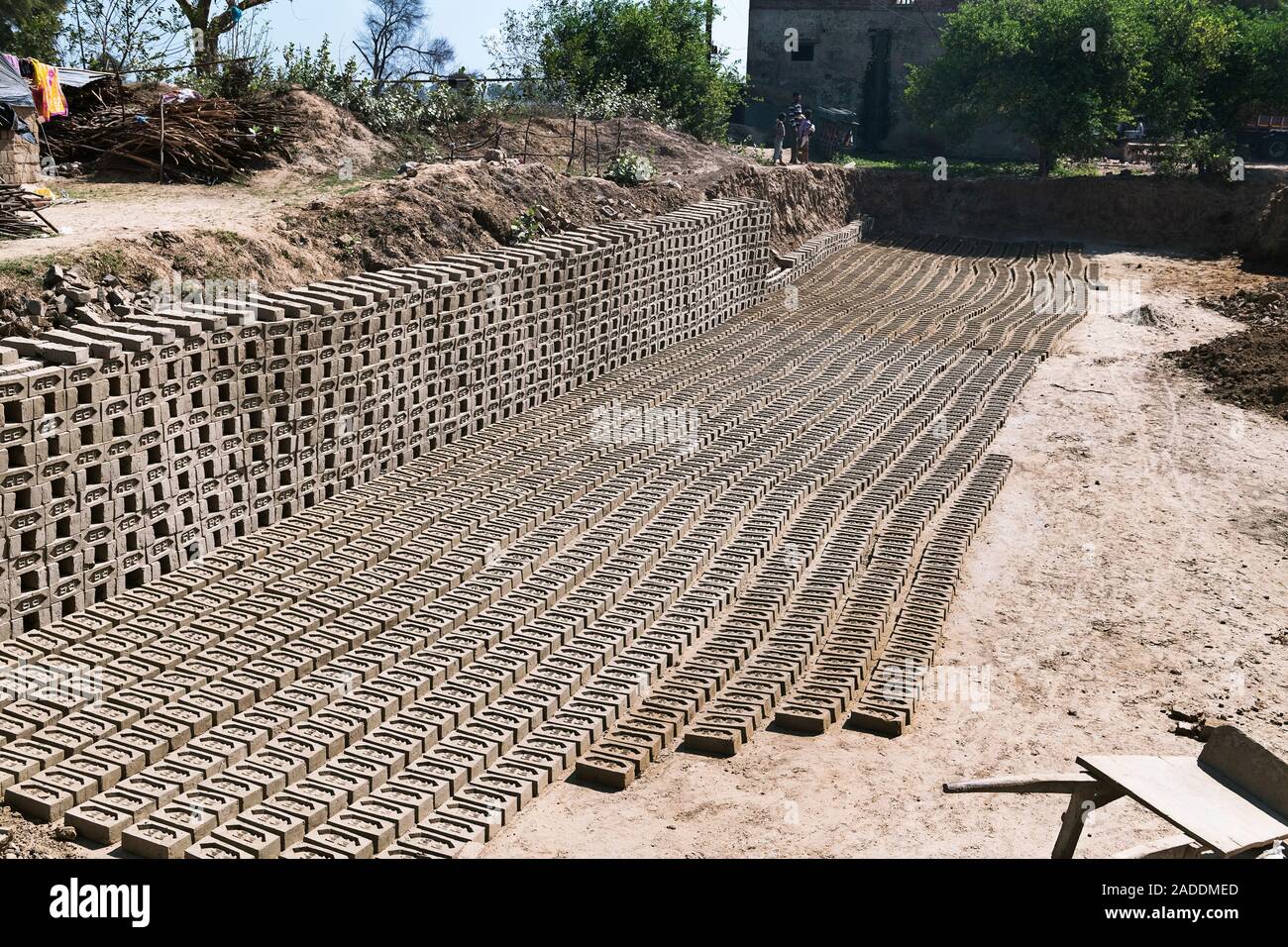 Mud bricks. Mud is shaped and either dried in the sun or baked in a ...