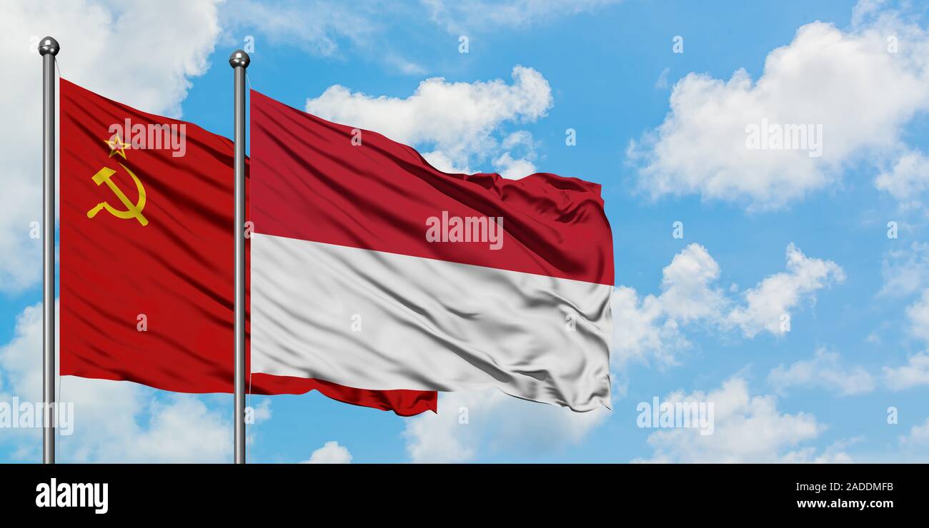 Soviet Union and Indonesia flag waving in the wind against white cloudy ...