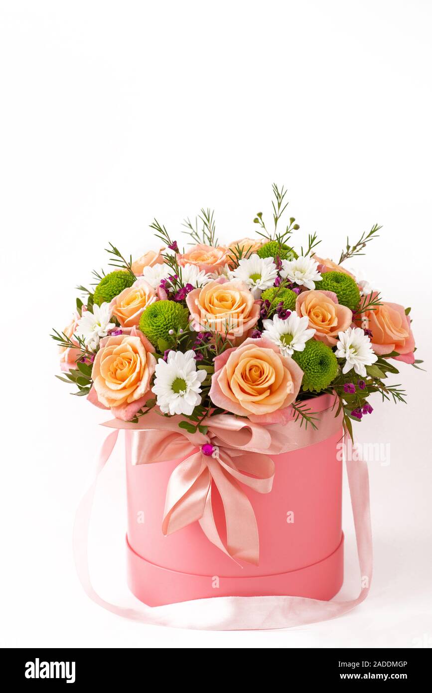 Beautiful bouquet in a pink luxury present box, isolated on white ...