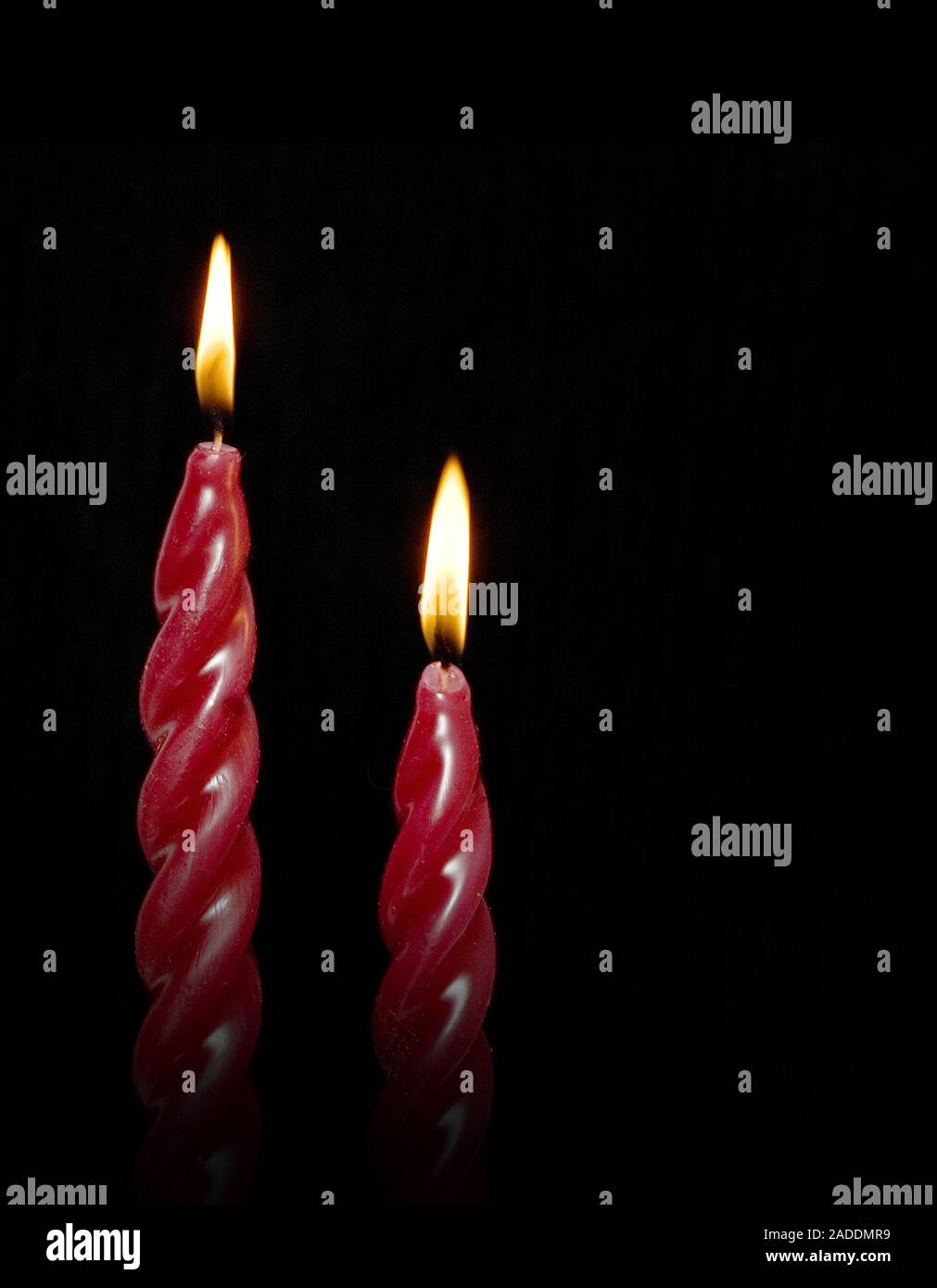Two candles in darkness Stock Photo - Alamy