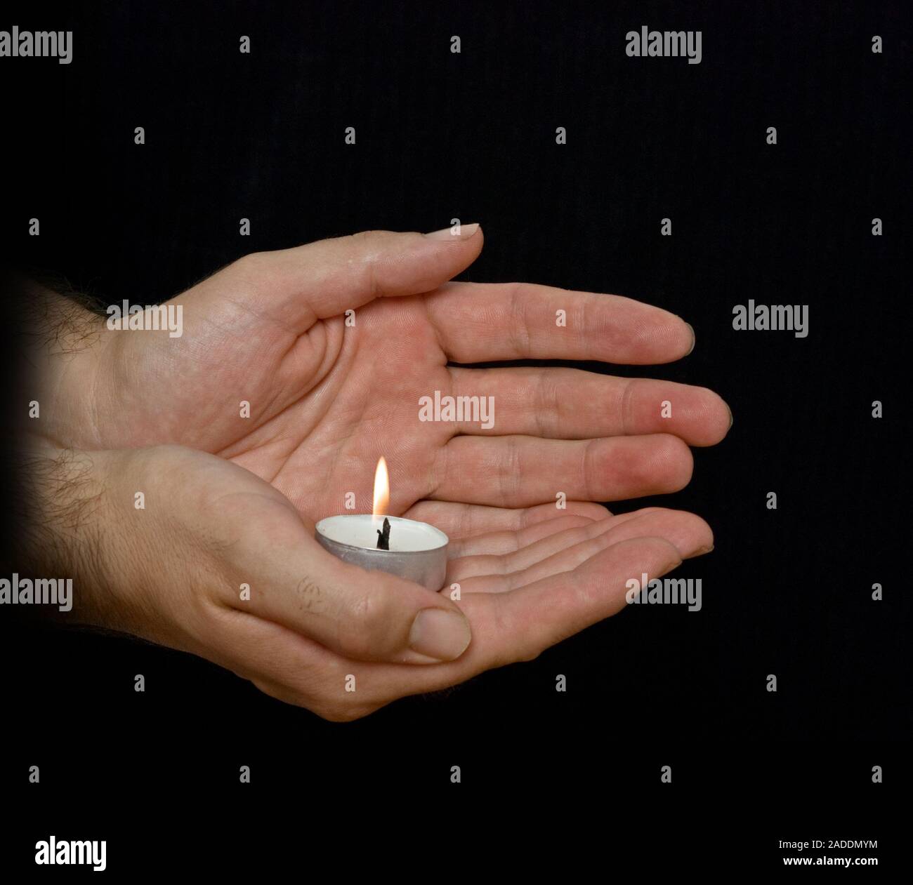 Candle in hand Stock Photo - Alamy