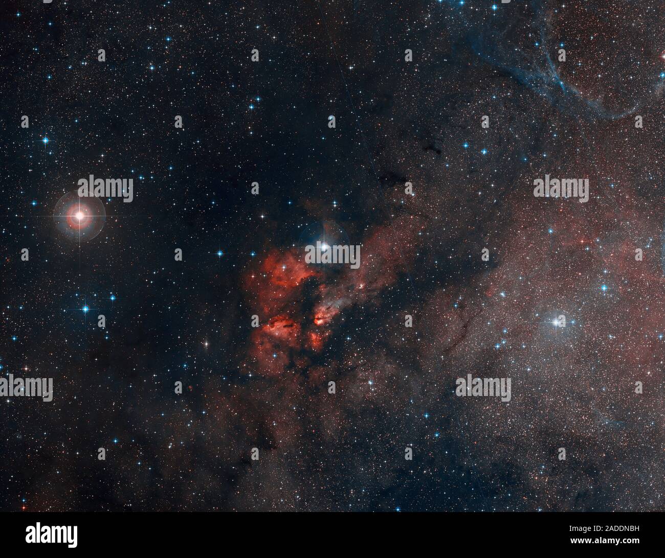 RCW 38 is a star cluster surrounded by clouds of brightly glowing gas ...