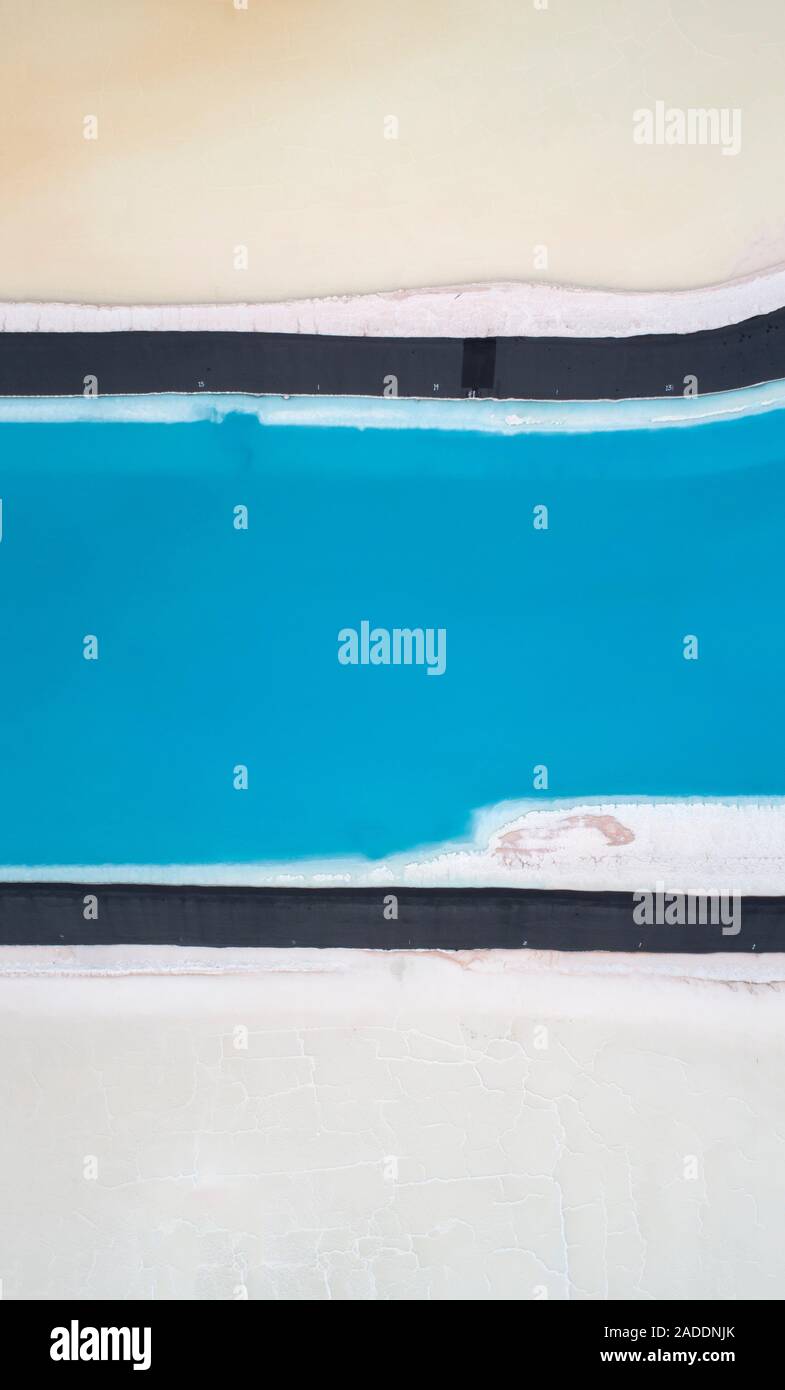 These bright blue evaporation ponds contain potassium chloride, a salt ...