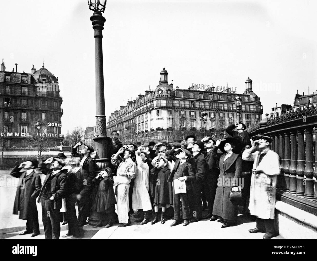 Observing the solar eclipse of 17 April 1912. People in the streets of ...