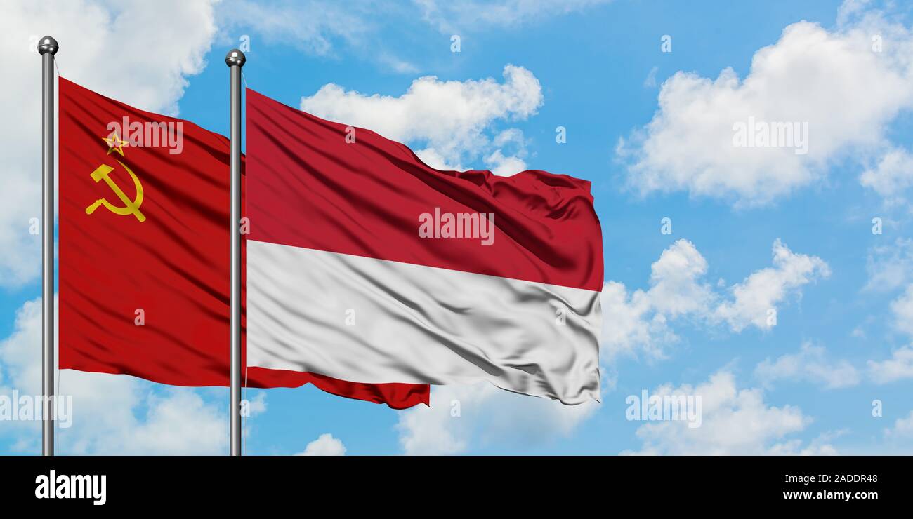 Soviet Union and Monaco flag waving in the wind against white cloudy ...